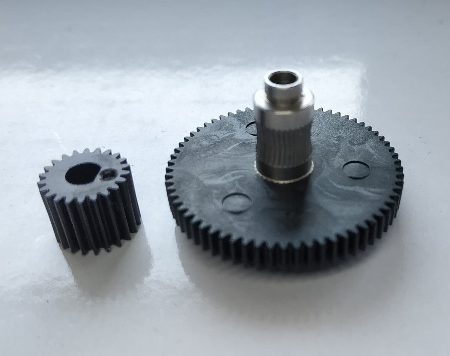 Titan extruder large & small gear wheels.